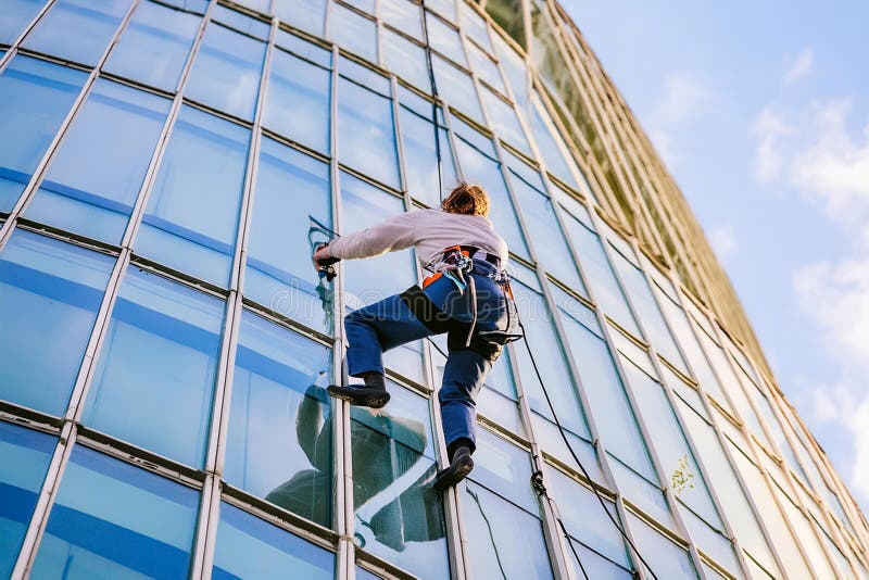 A Worker is Cleaning the Windows of a Tall Building Stock Illustration ...