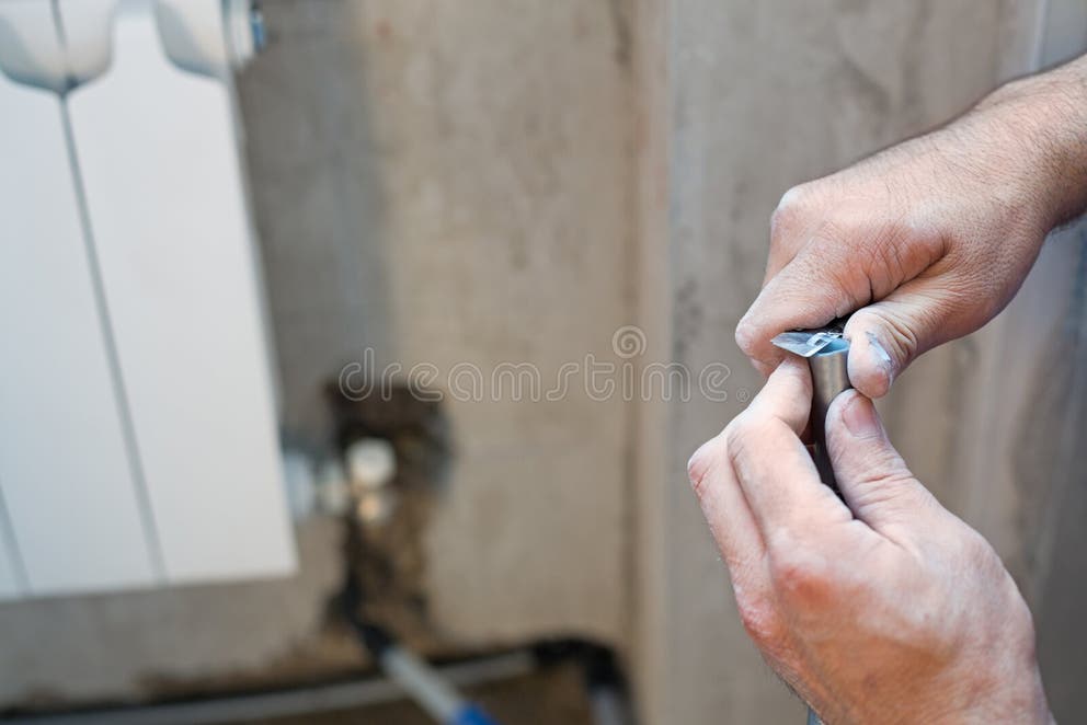 A Worker Cleans the Pipe Preparing it for Stock Image - Image of people ...