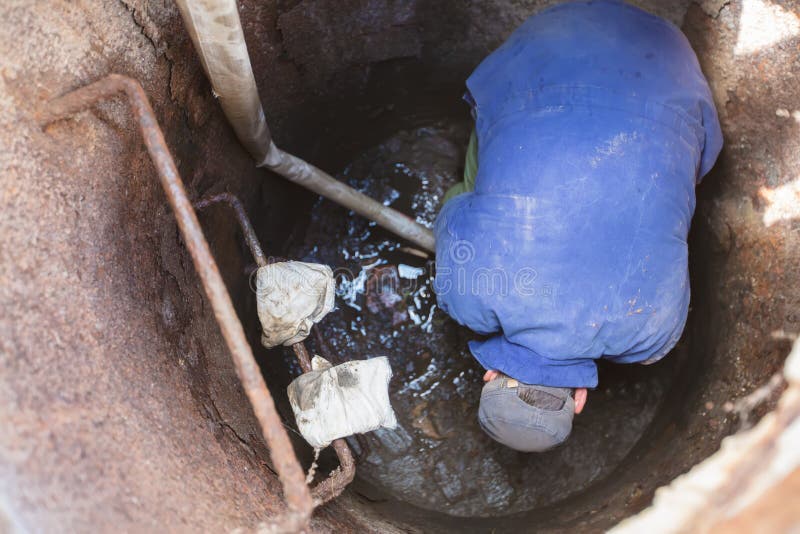 Worker Cleans the Sewer Hatch. Stock Image - Image of outdoor, hole ...