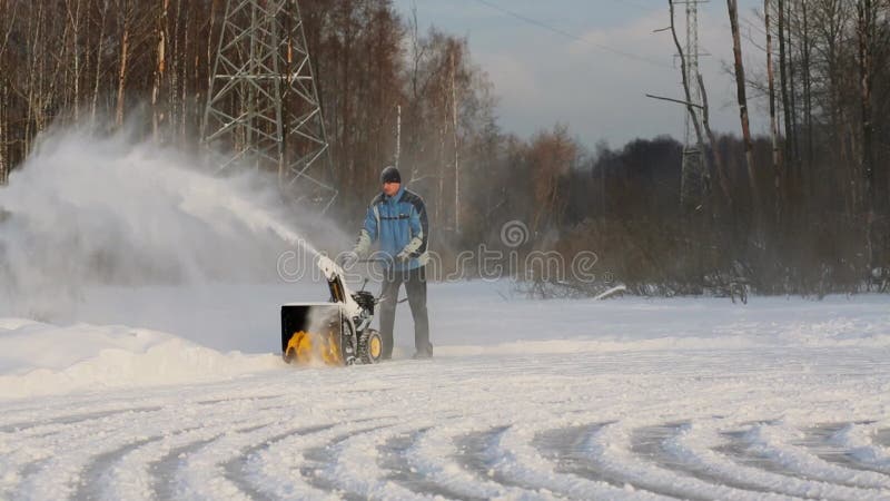 Worker Cleans Snow with Motorized Machine at Stock Video - Video of ...