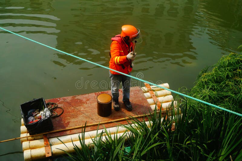 Shenzhen, China: Workers Clean Up Plastic Waste on a River Editorial ...