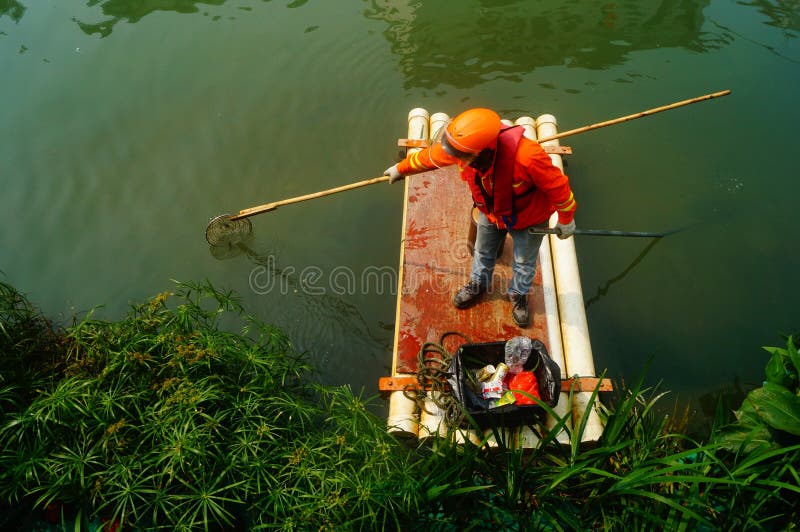 Shenzhen, China: Workers Clean Up Plastic Waste on a River Editorial ...