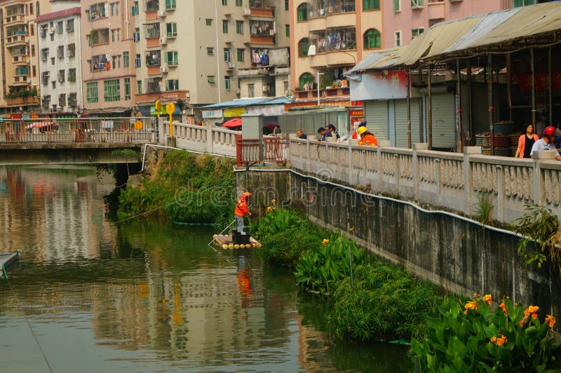 Shenzhen, China: Workers Clean Up Plastic Waste on a River Editorial ...