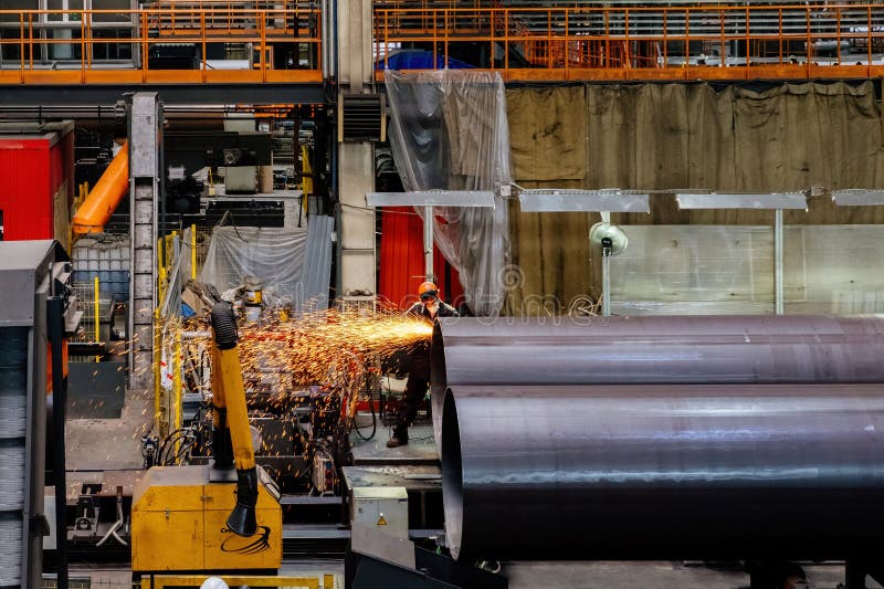 Worker Cleans Welded Seam on Steel Pipe Using Grinding Machine Stock ...