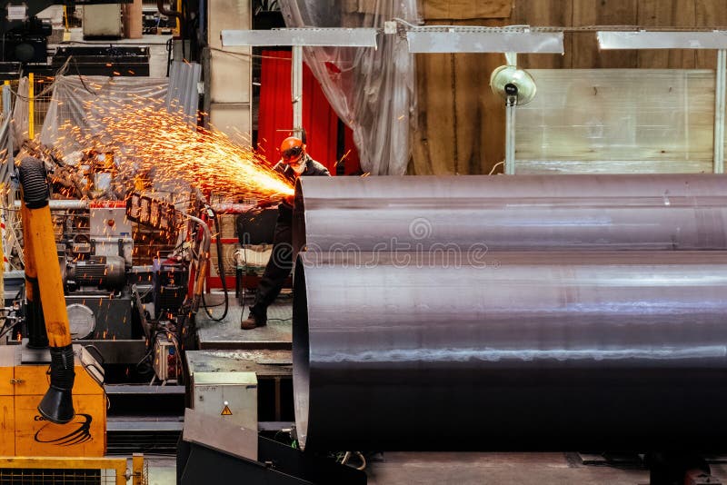 Worker Cleans Welded Seam on Steel Pipe Using Grinding Machine Stock ...