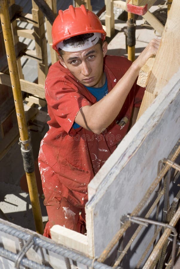 Worker Climbs Ladder - Vertical Stock Photo - Image of crew, orange ...
