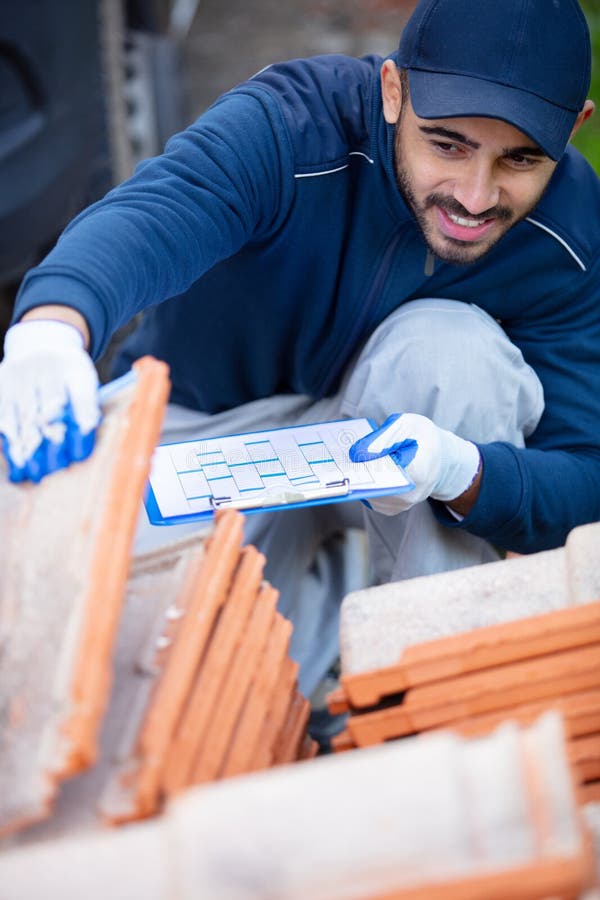 Worker with Clipboard Checking Construction Materials Stock Image ...