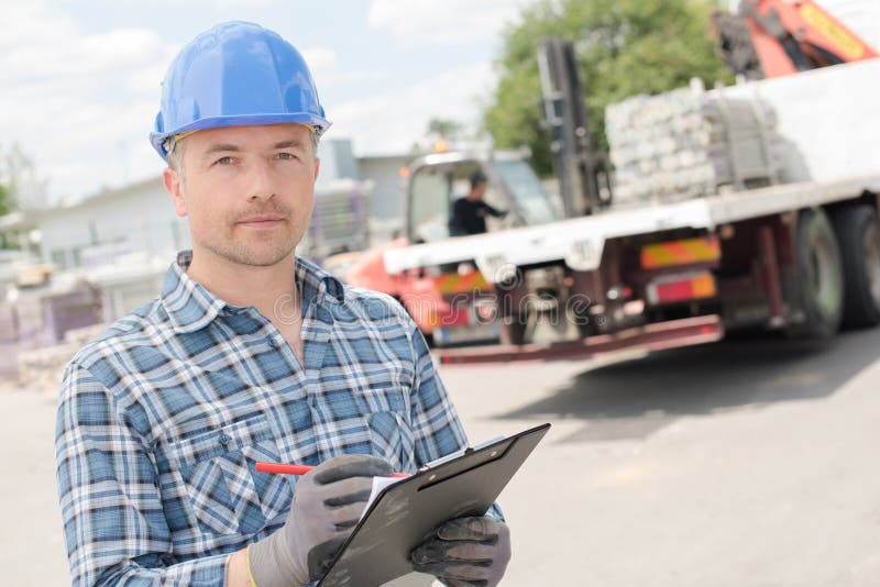 Worker With Clipboard In Front Truck Stock Image - Image of load ...