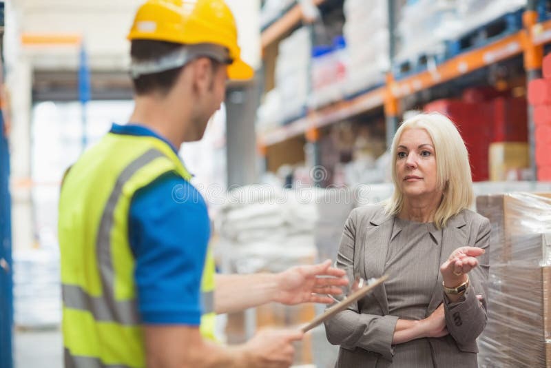 Worker with Clipboard Speaking with His Manager Stock Image - Image of ...