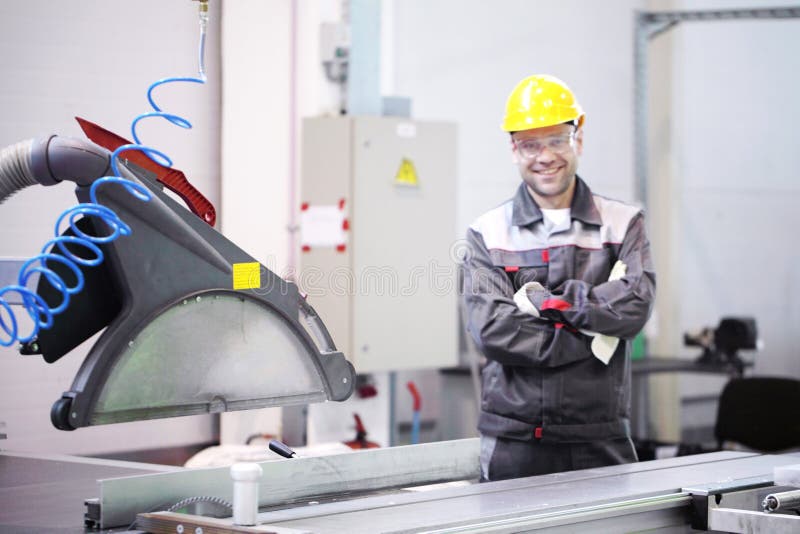 Worker at CNC machine shop stock photo. Image of industrial - 75406874