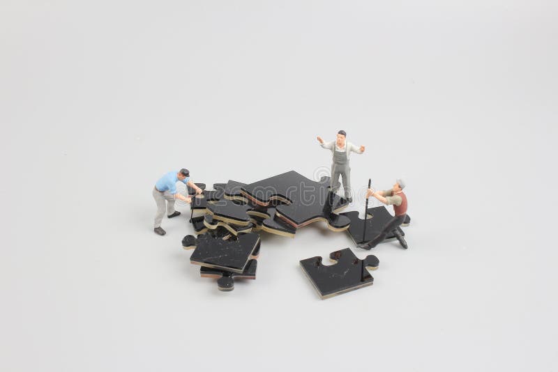 Worker Collaborate Holding Up Jigsaw Puzzle Pieces Stock Photo - Image ...