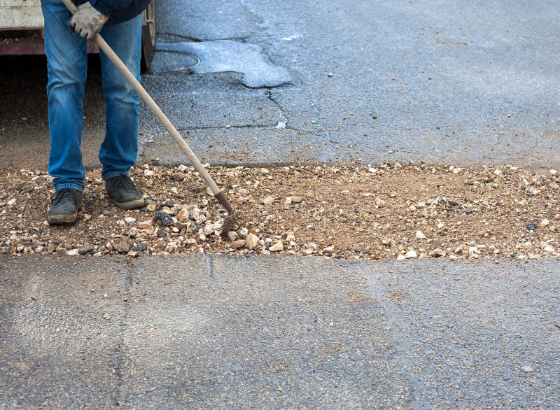 Worker Committed To the Repair of a Large Pit Road Stock Photo - Image ...
