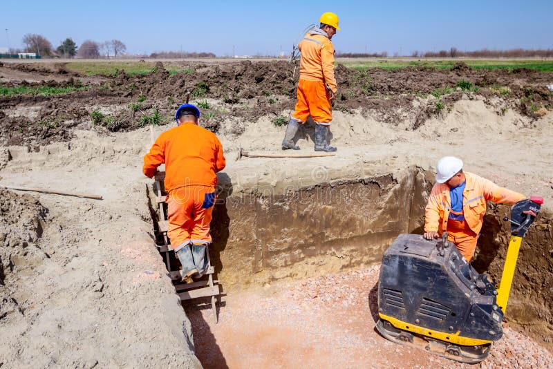 Worker Compacting Sand with Vibrating Plate Tamper Editorial Stock ...