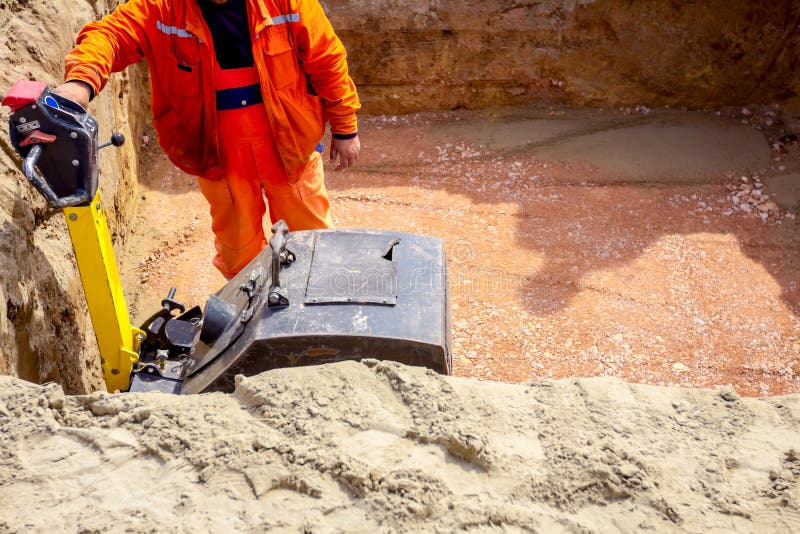 Vibration Plate Compactor, Compacting Soil Stock Photo - Image of ...