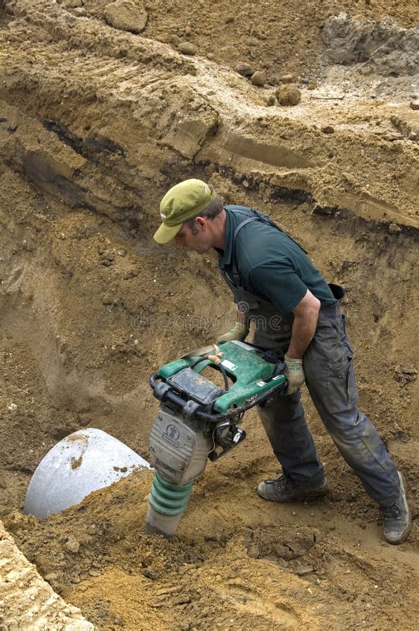 Soil compacting stock photo. Image of people, building - 620802