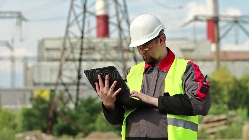 Worker with Computer at Power Station Stock Video - Video of yellow ...