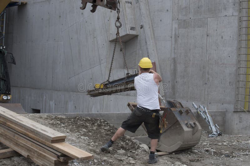 Worker with Construction Crane with Heavy Load Editorial Image - Image ...