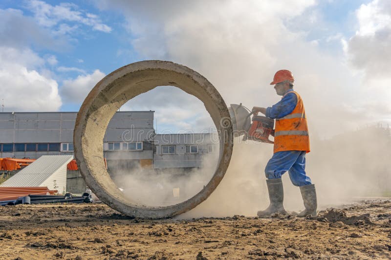 Builder in Orange Uniform with a Concrete Cutter Stock Image - Image of ...