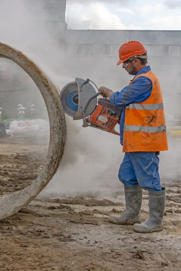 Builder in Orange Uniform with a Concrete Cutter Stock Image - Image of ...