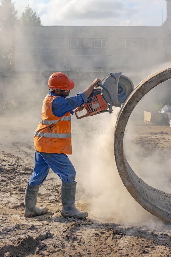 Builder in Orange Uniform with a Concrete Cutter Stock Image - Image of ...
