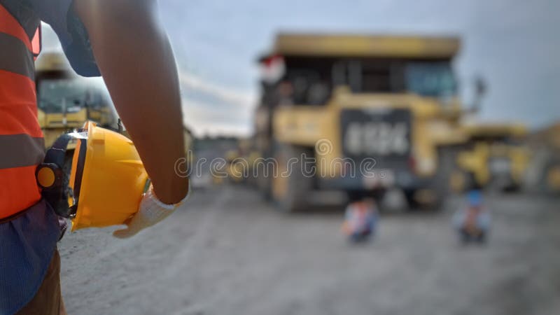 A Worker at Construction Site. he Looking at the Worksite the ...