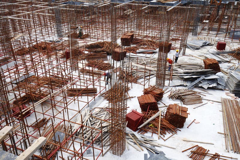 Worker in the Construction Site Making Reinforcement Metal Framework ...