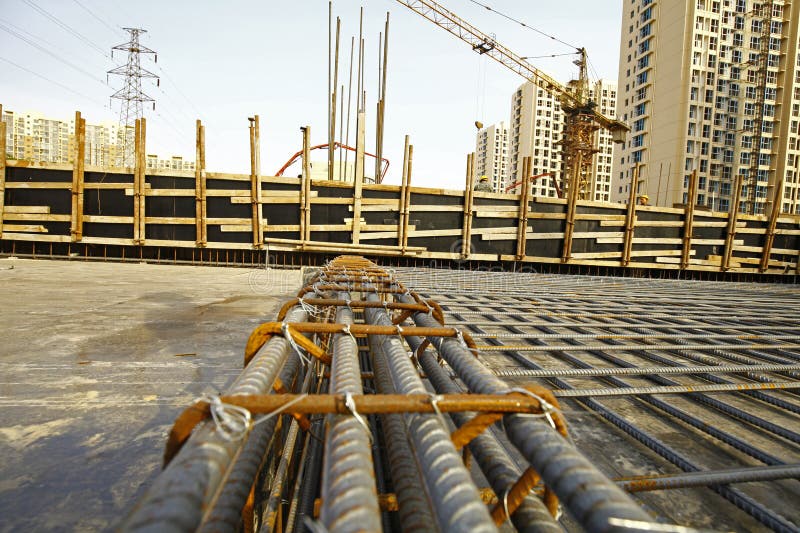 Worker in the Construction Site Making Reinforcement Metal Framework ...