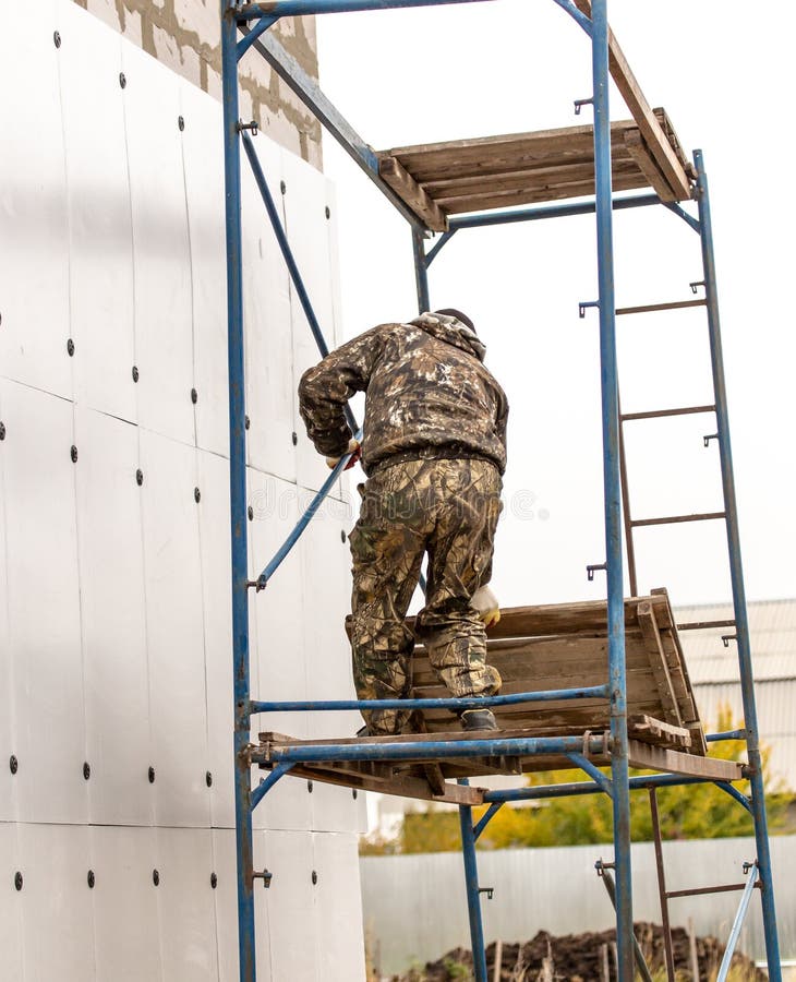 Worker on the Construction of Wall Insulation in the House Stock Image ...