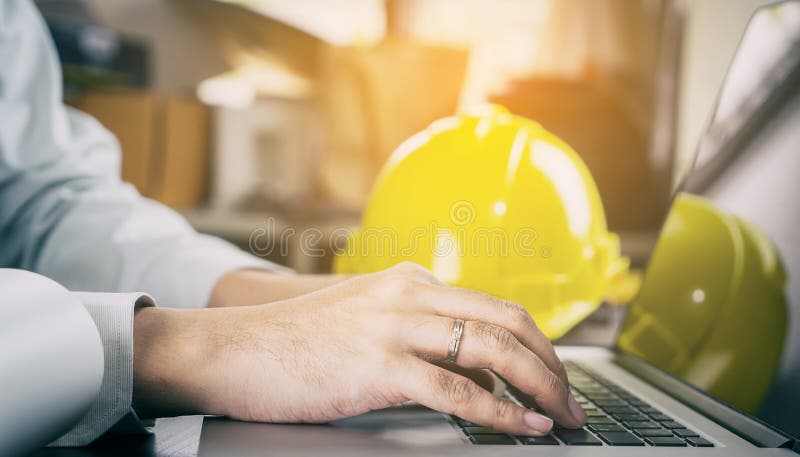 Worker in Construction is Working on Computer. Stock Image - Image of ...