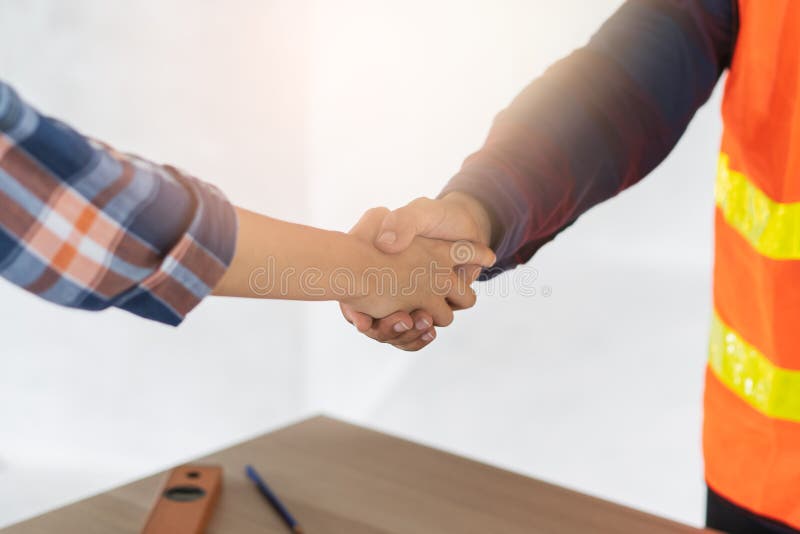 Worker and Contractor. Client Shaking Hands with Team Builder in ...
