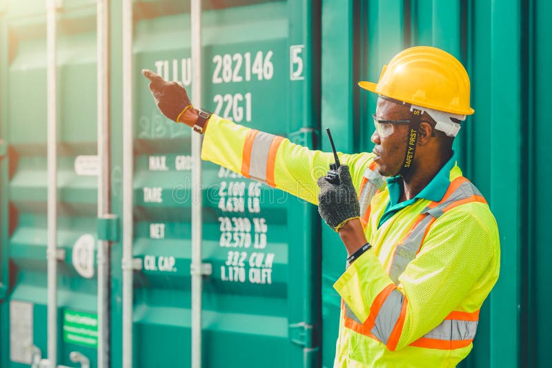 Worker Control Loading Containers Cargo at Port Shipyard with Green ...