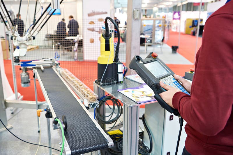Worker with Control Panels for Manipulators for Food Production Stock ...