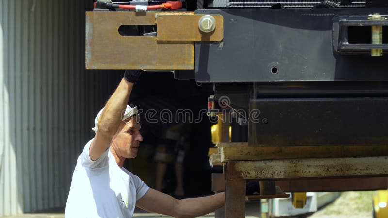 Worker Control the Process of Putting Cargo on the Steel Rack Stock ...