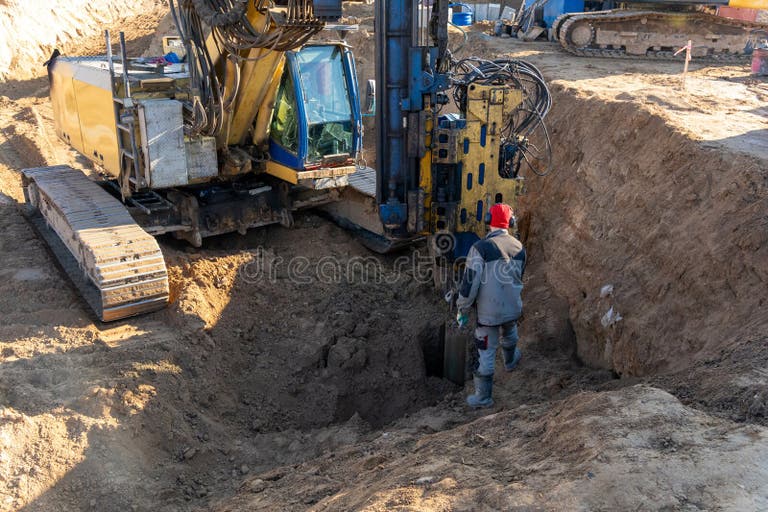 A Worker Controls the Extraction of Larssen Sheet Piling from the ...