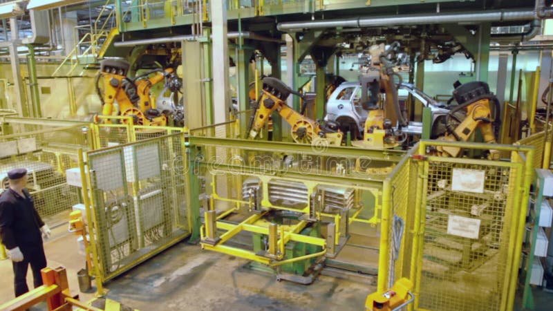 Worker Controls Robotics Which Work in Production Stock Footage - Video ...