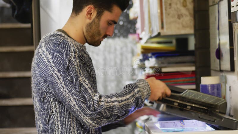 Worker Copying Papers in Shop Stock Photo - Image of device ...