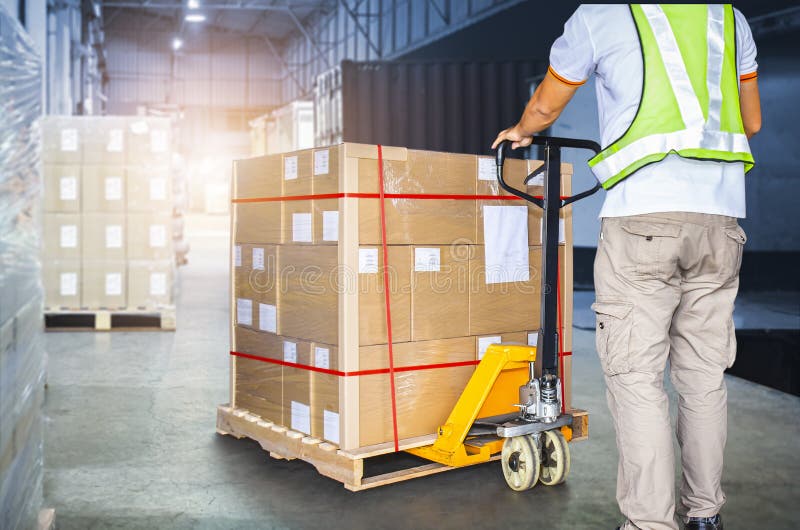 Worker Courier Unloading Package Boxes in Distribution Warehouse Center ...
