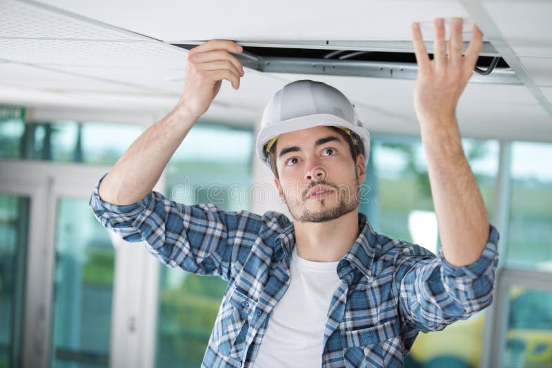 Worker Covering Opening in Ceiling Stock Image - Image of builder, tool ...