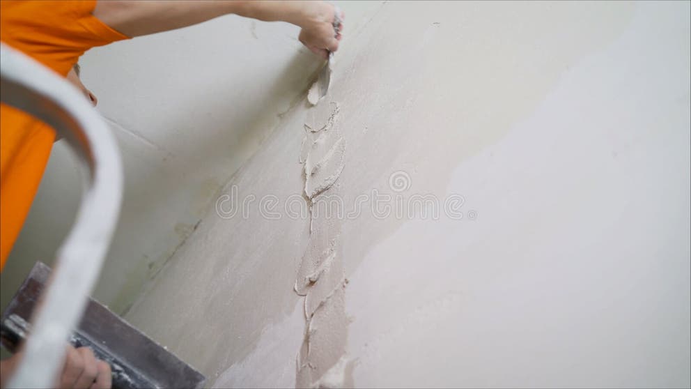 Plasterer Putting Plaster on Wall. Worker Covers the Wall with Mortar ...
