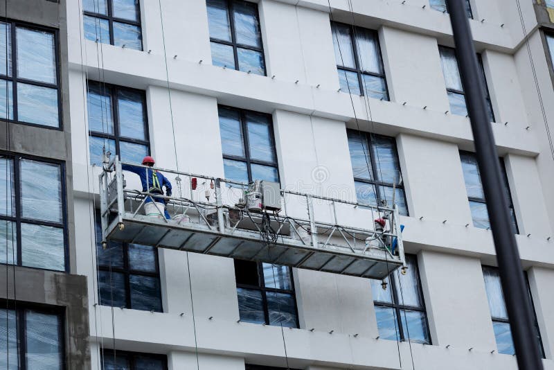 A Worker in a Cradle of a Lifting Mechanism Stock Image - Image of ...