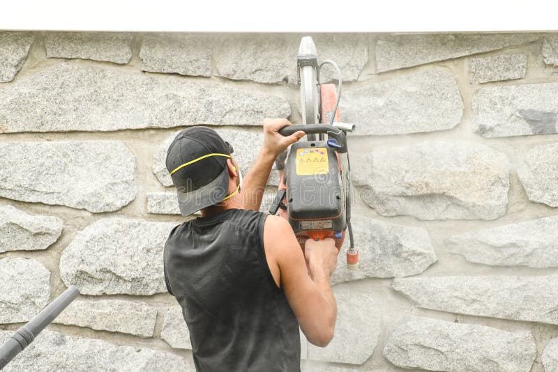 Worker Cut Stone in a House Under Construction with Saw Stock Photo ...