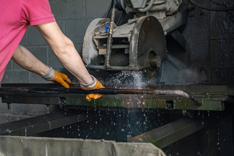A Worker Cuts Granite. the Cutter Cuts Granite Stock Image - Image of ...