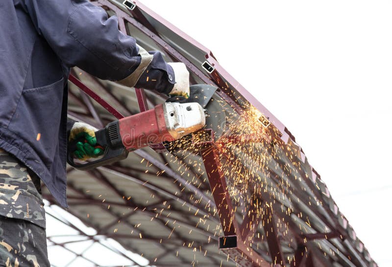 A Worker Cuts Metal on a Canopy. Stock Photo - Image of frame, sparks ...