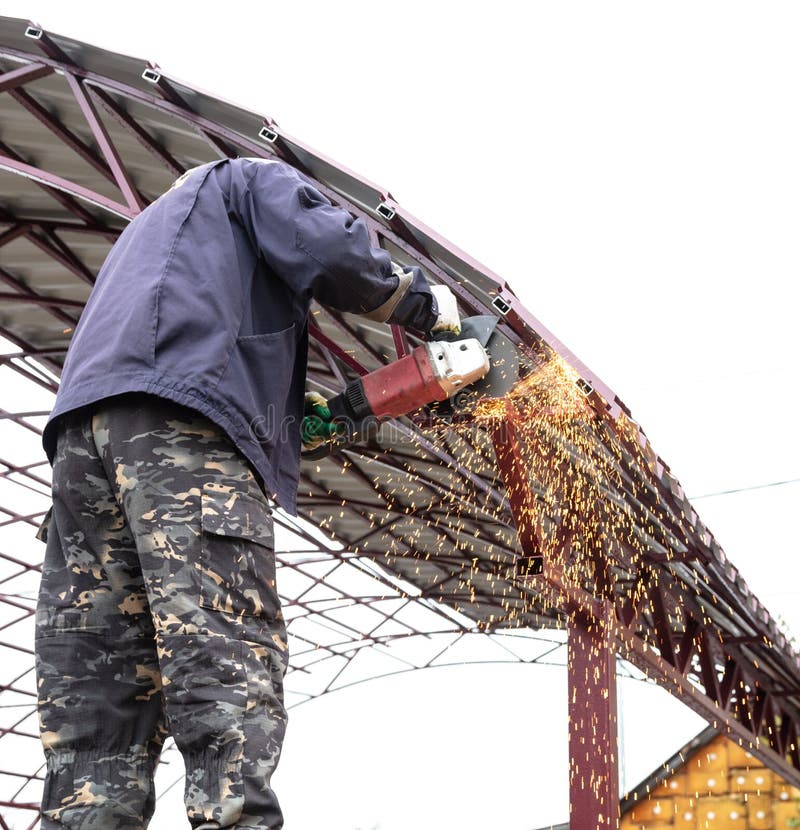 A Worker Cuts Metal on a Canopy. Stock Photo - Image of selftapping ...