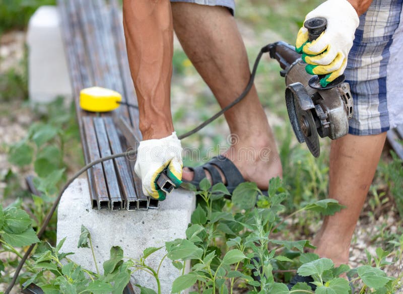 A Worker Cuts Metal at a Construction Site Stock Image - Image of work ...