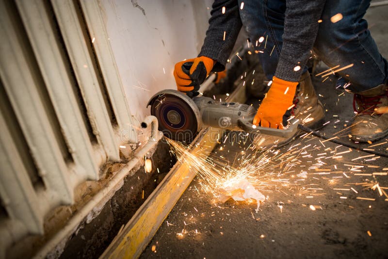 Worker Cuts a Metal Pipe at a Construction Site Stock Image - Image of ...