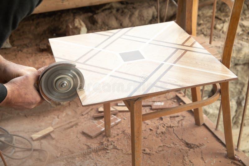 Worker Cutting a Ceramic Tile with a Grinder Stock Photo - Image of ...