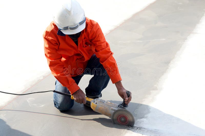 Worker cutting concrete stock image. Image of tool, circular - 66637235