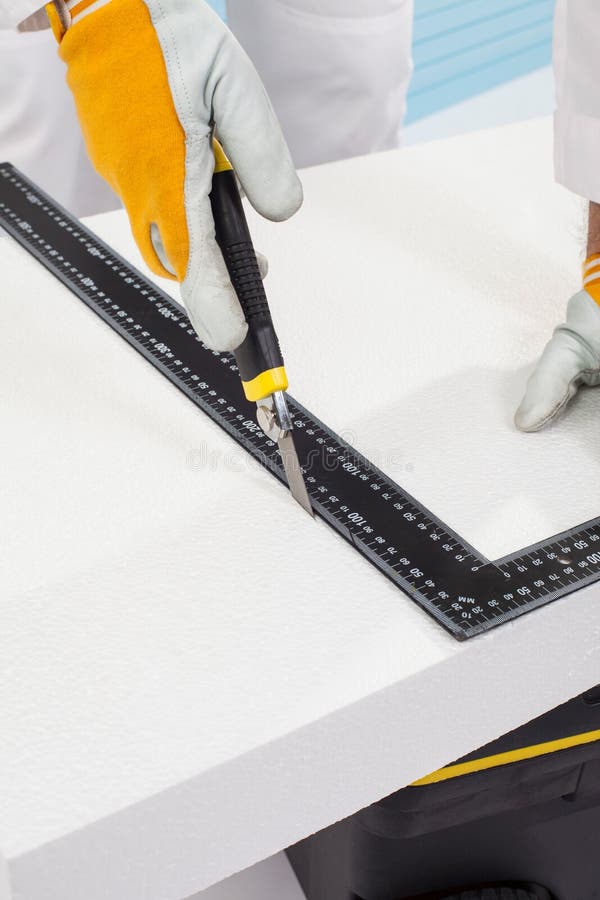 Worker Cutting an Insulation Panel with a Scale Model Knife Stock Photo ...