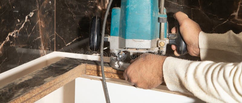 Worker Cutting Kitchen Countertop Using Electric Saw Stock Photo ...